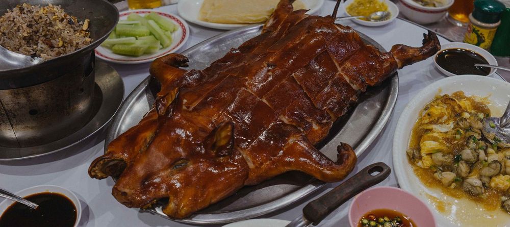 You absolutely have to eat Whole Suckling Pig at Tang Jai Yoo in ...