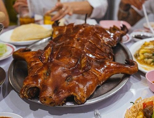 You absolutely have to eat Whole Suckling Pig at Tang Jai Yoo in ...